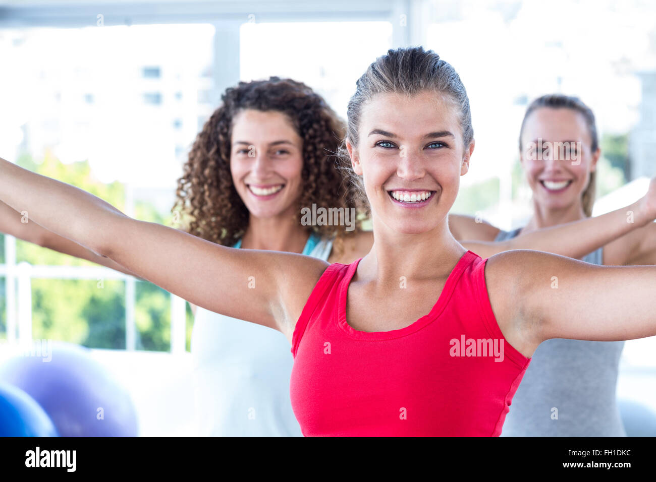 Portrait of cheerful women with arms outstretched Stock Photo - Alamy