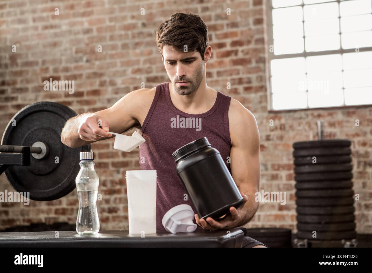 Adding weights hi-res stock photography and images - Alamy