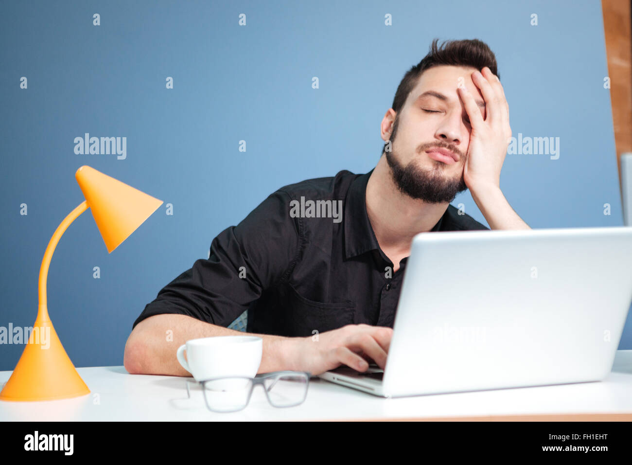 Tired businessman sleeping on the table in office Stock Photo - Alamy