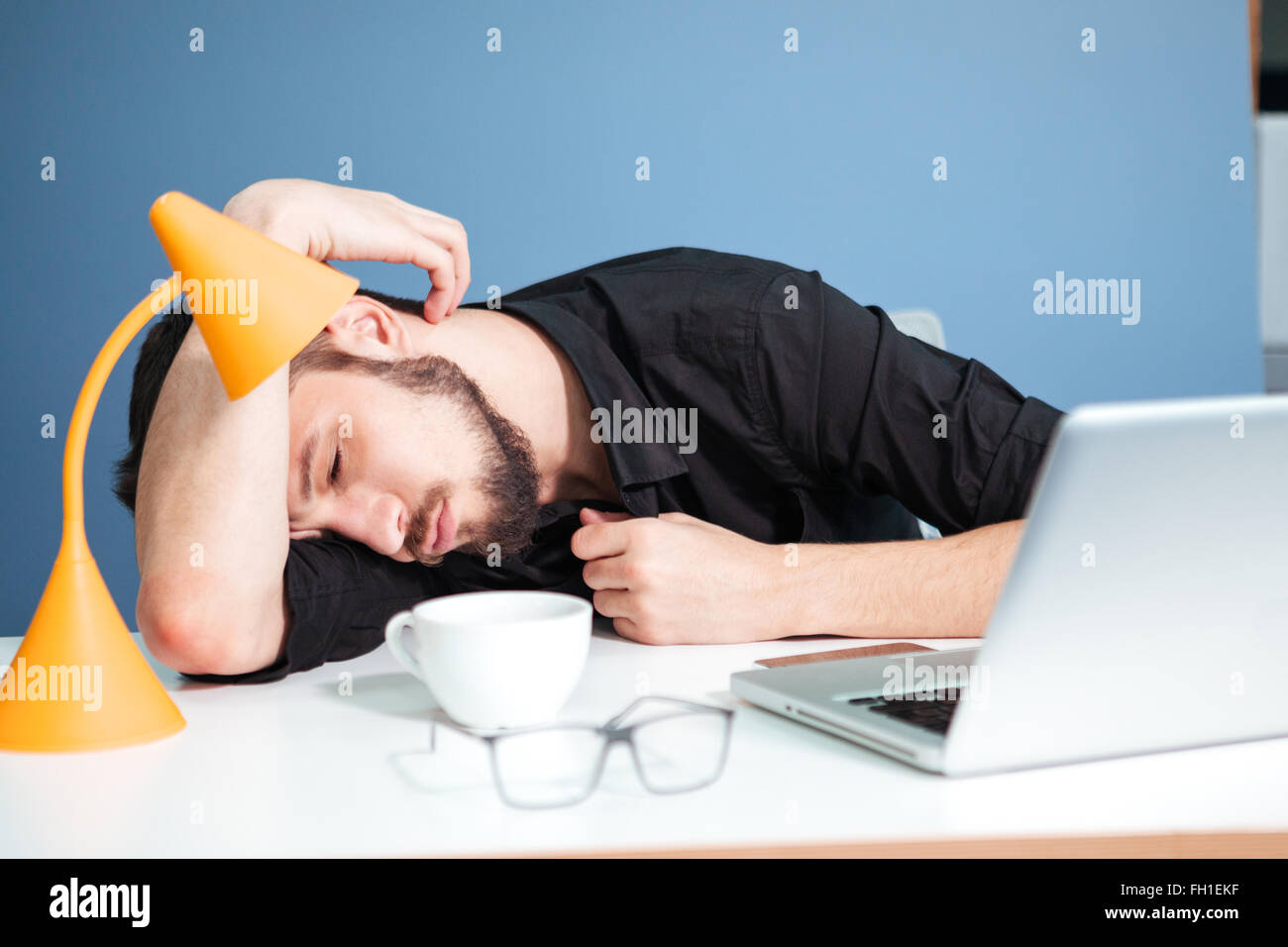 Man sleeping in office hi-res stock photography and images - Alamy