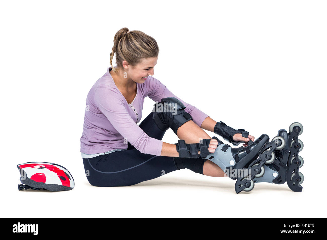 Young woman wearing inline skates Stock Photo - Alamy