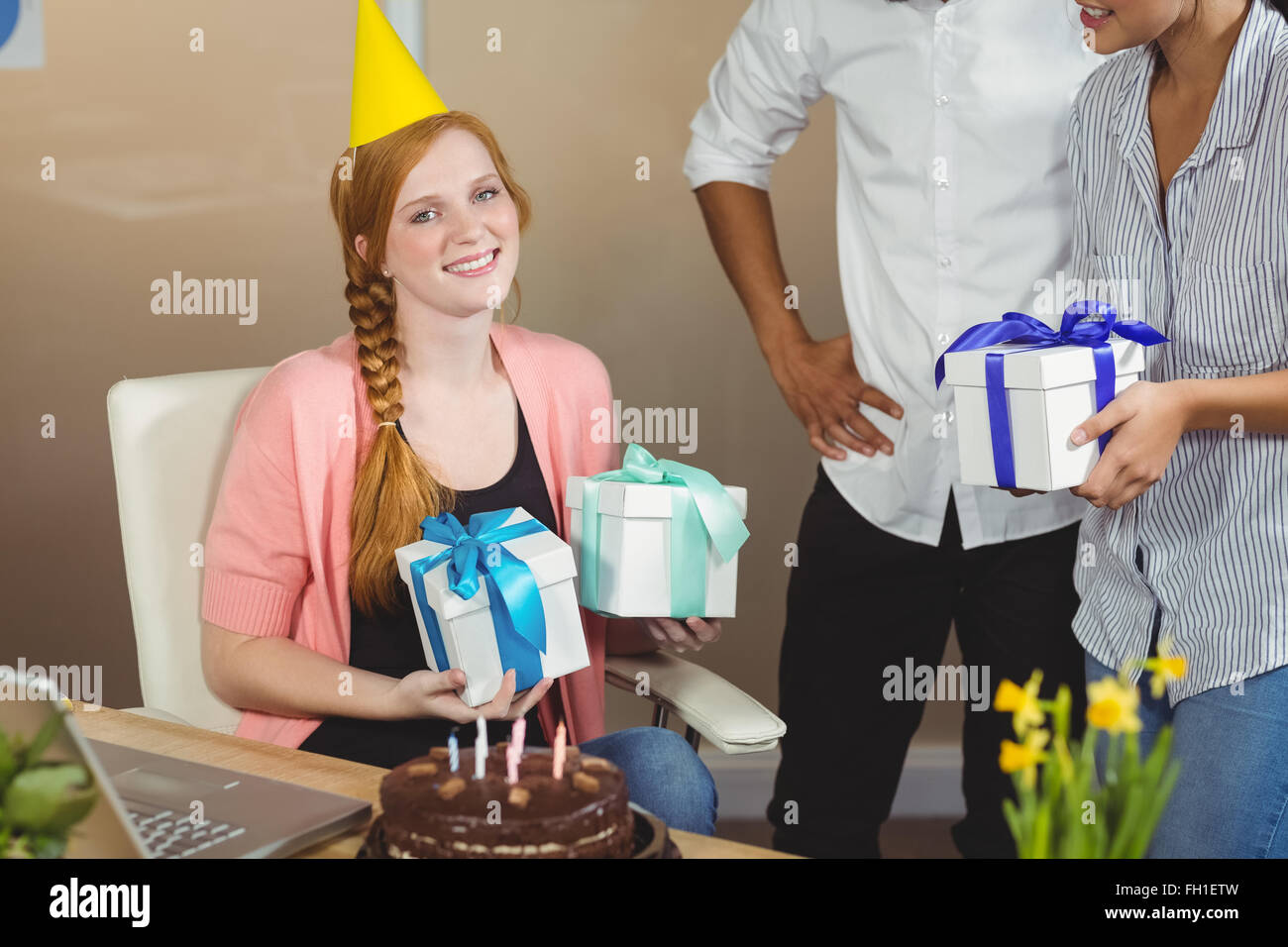 Portrait of happy businesswoman receiving birthday gifts Stock Photo ...