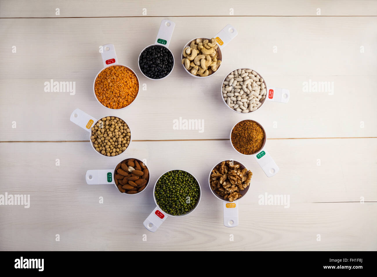 Portion cups of healthy ingredients Stock Photo - Alamy