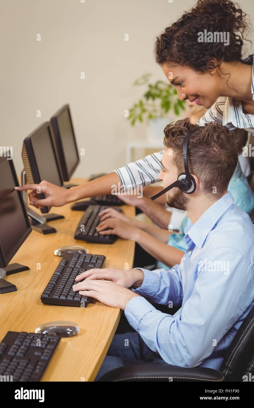 Customer center employee gesturing hi-res stock photography and images ...