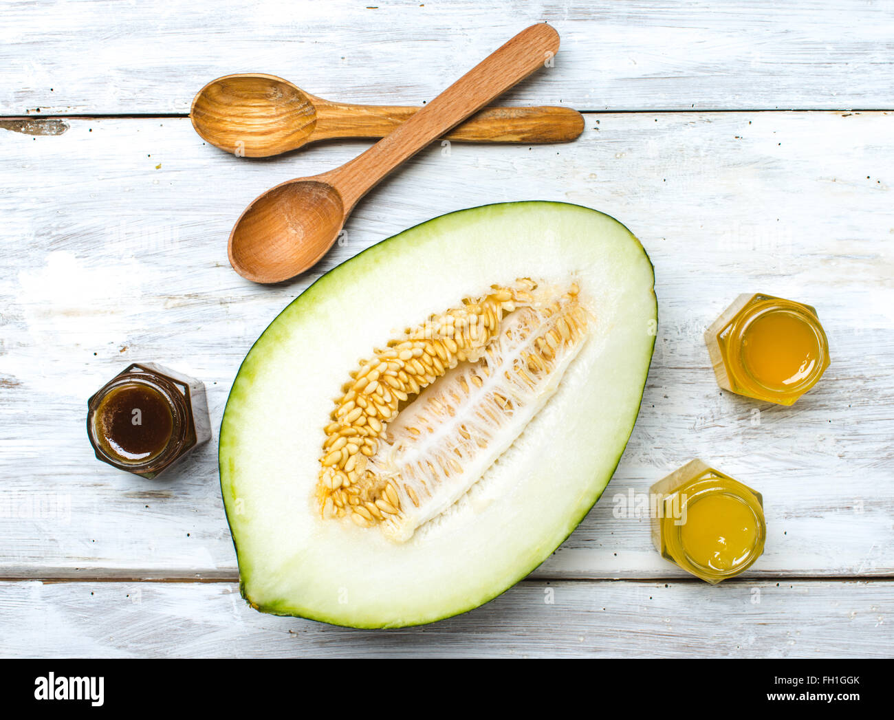 Healthy melon with honey on rustic wooden white board Stock Photo - Alamy