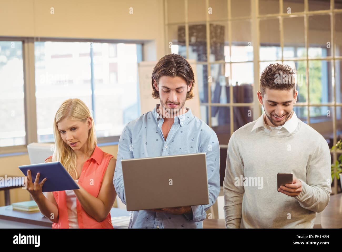 Business people using various technologies Stock Photo - Alamy