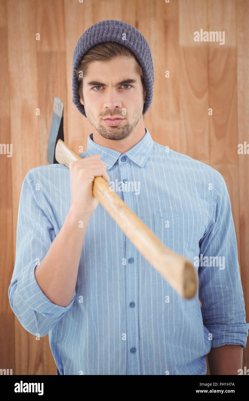 Portrait of serious hipster holding axe on shoulder Stock Photo - Alamy
