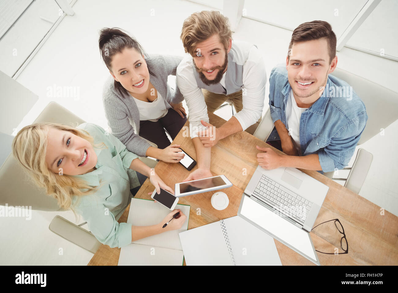 Overhead portrait of smiling business people Stock Photo - Alamy