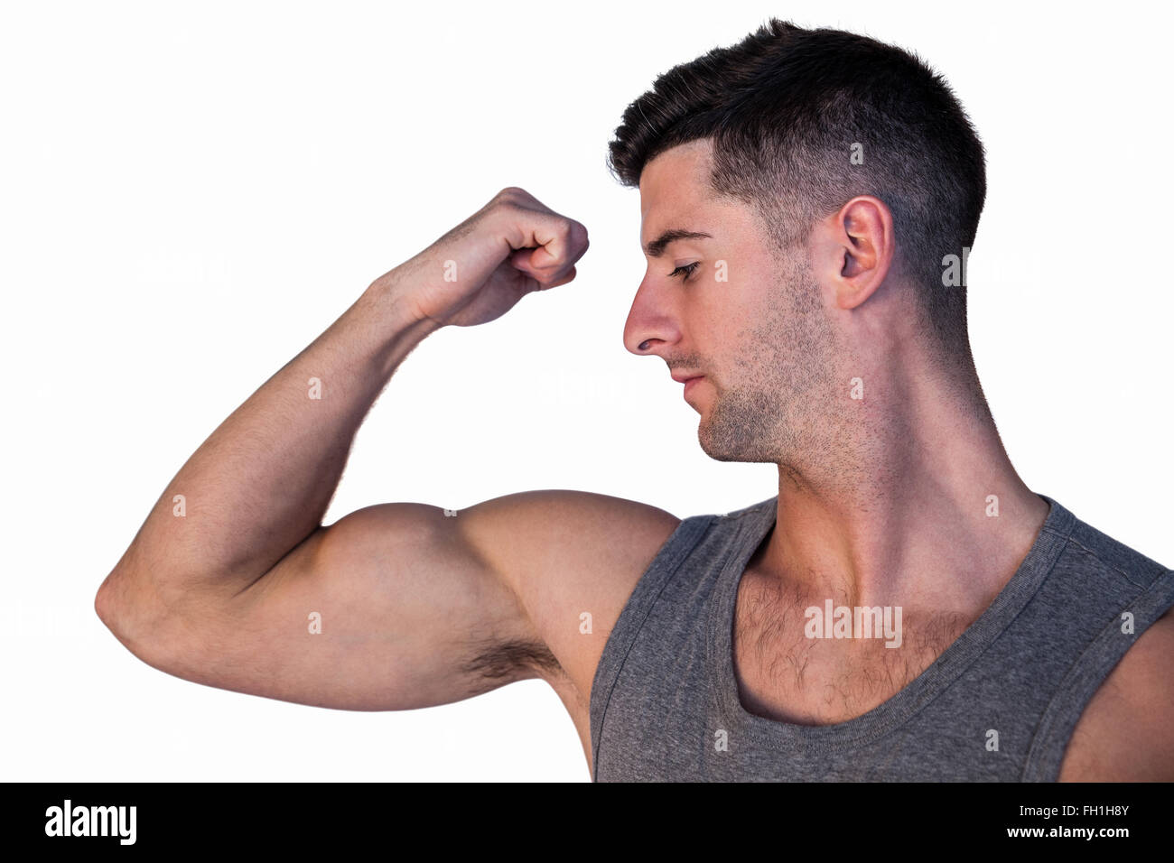 Handsome man showing biceps Stock Photo - Alamy