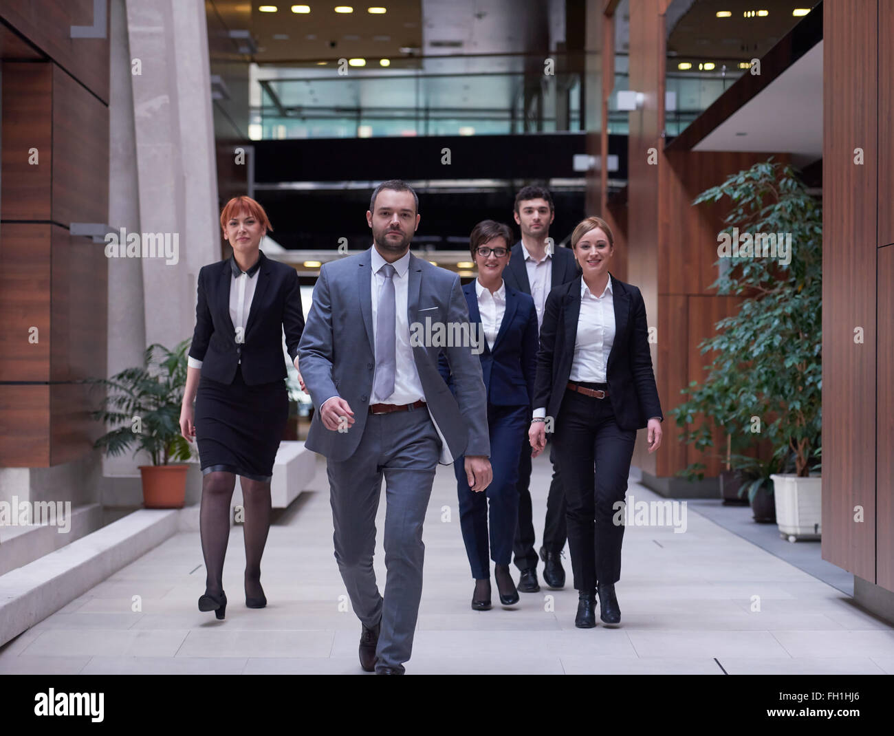 business people team walking Stock Photo - Alamy