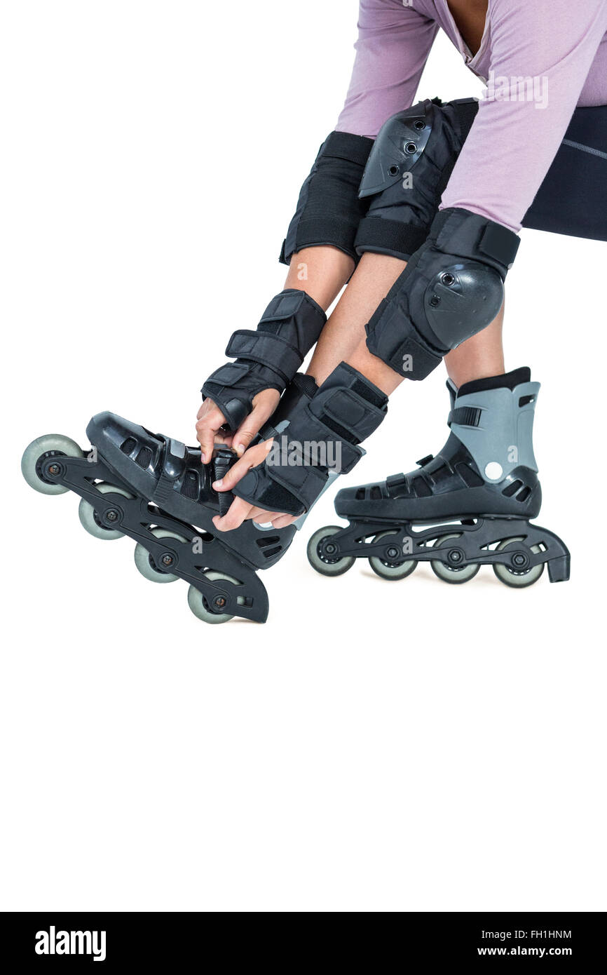 Low section of sporty woman wearing inline skates Stock Photo - Alamy