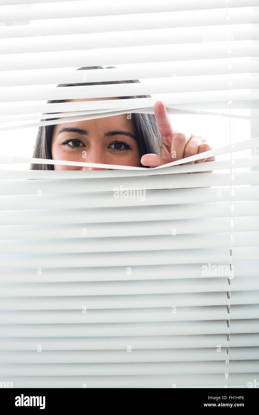 Peeking woman blinds hi-res stock photography and images - Alamy