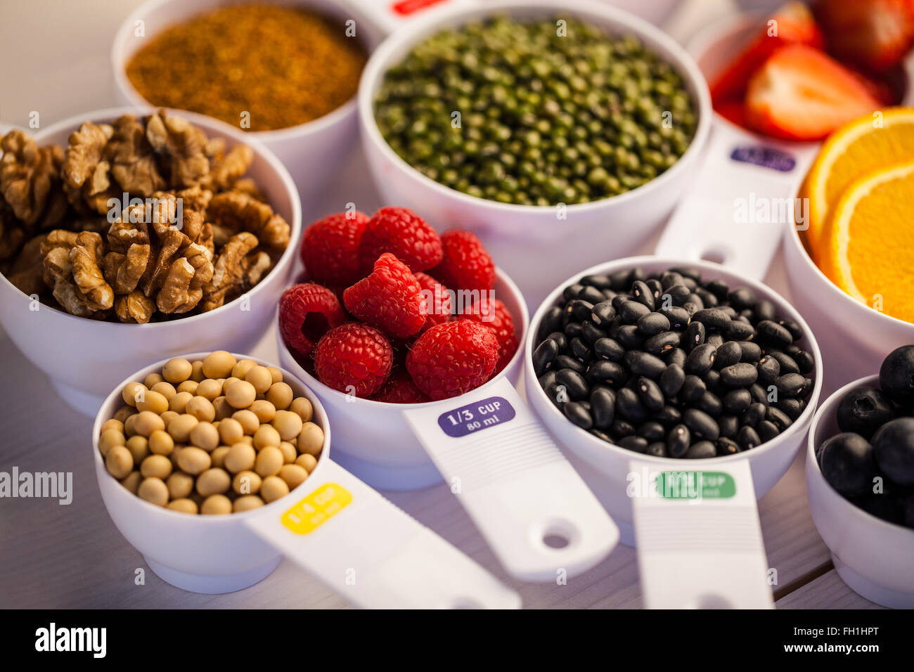 Portion cups of healthy ingredients Stock Photo - Alamy