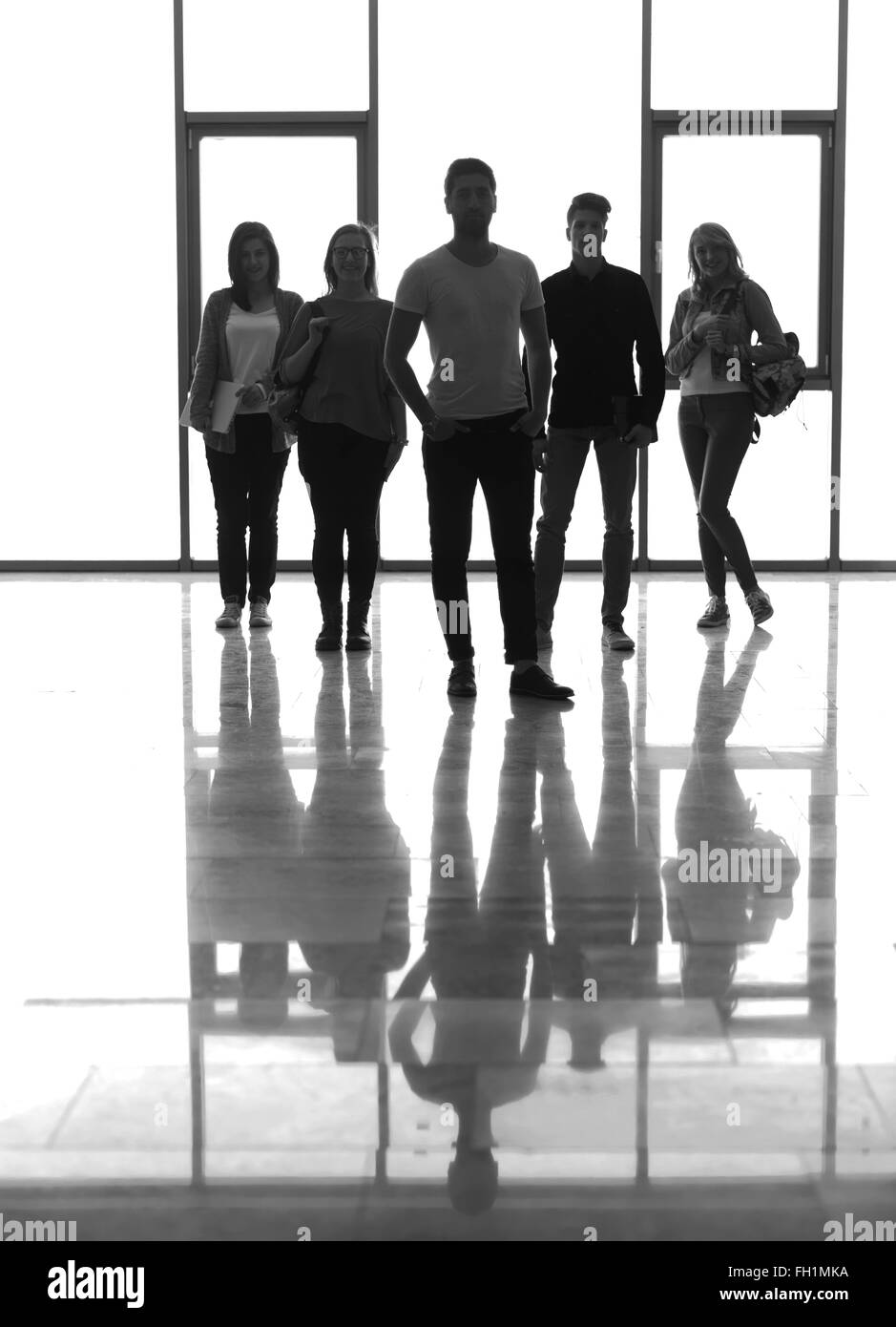 students group standing together as team Stock Photo - Alamy