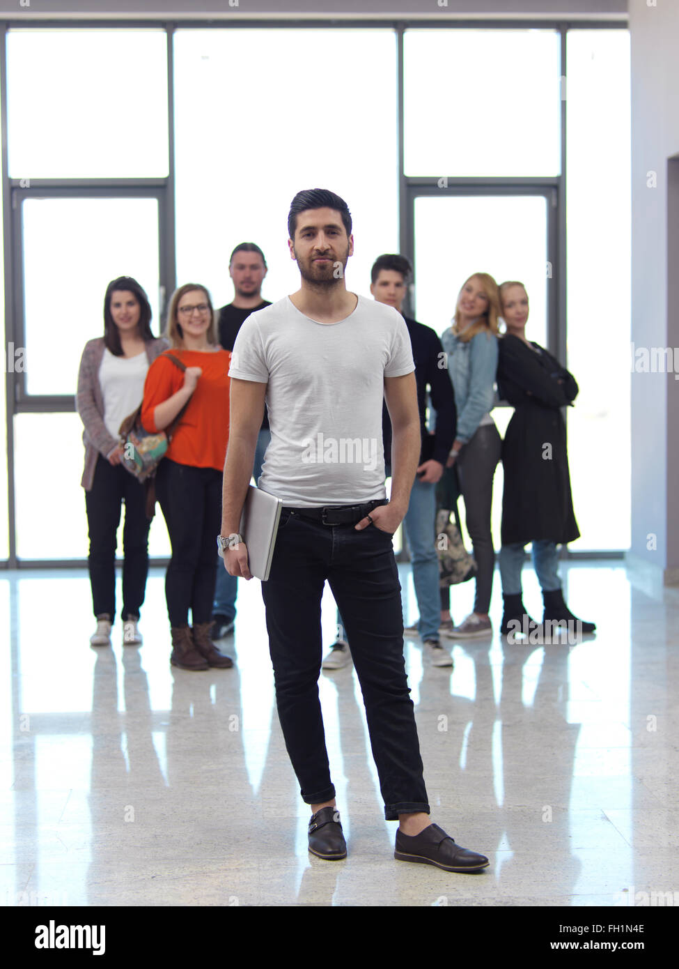 students group standing together as team Stock Photo - Alamy
