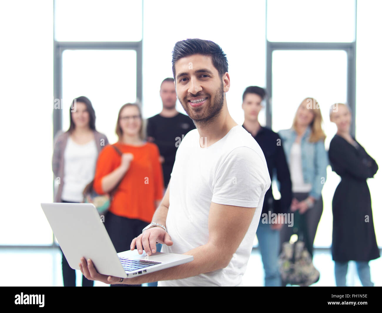 students group standing together as team Stock Photo - Alamy