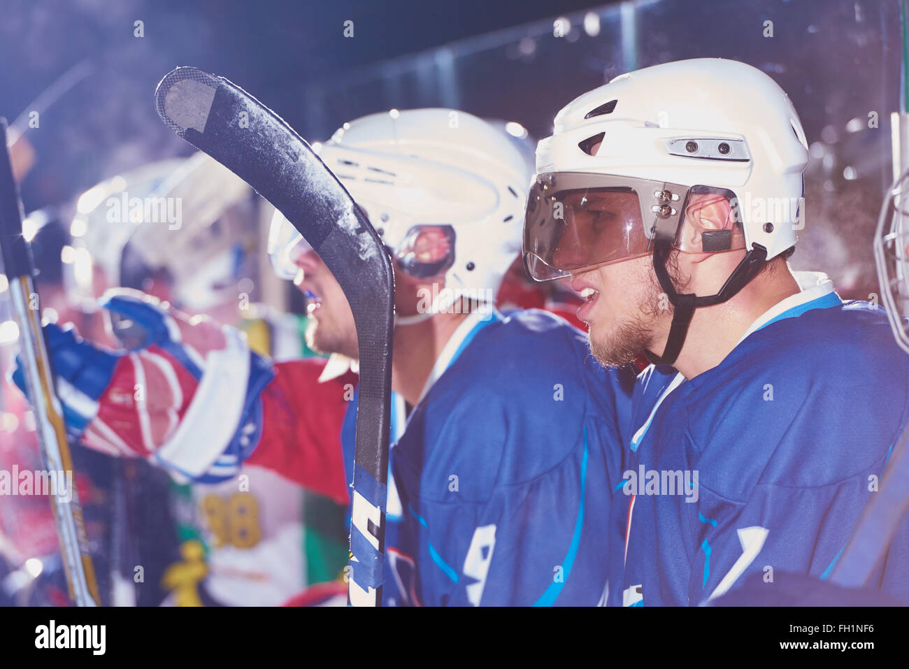 ice hockey players on bench Stock Photo - Alamy