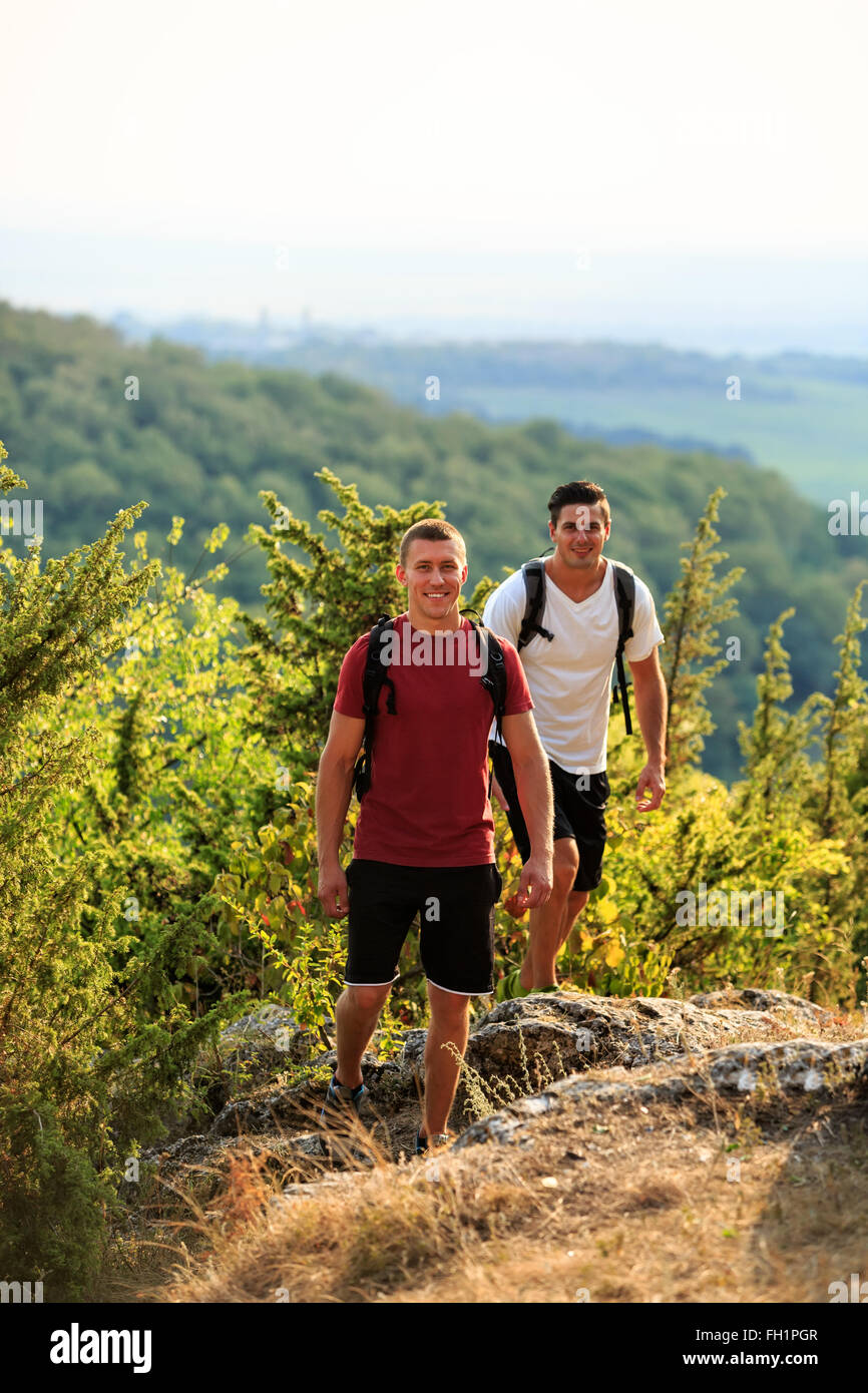 Two men hiking top mountain summer hi-res stock photography and images ...