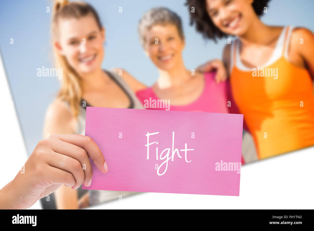 Fight against sporty women smiling at camera Stock Photo - Alamy