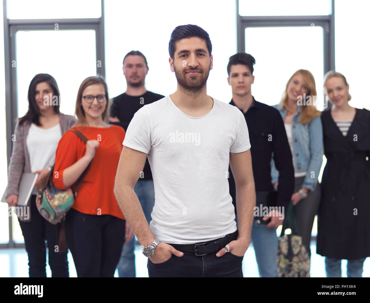 students group standing together as team Stock Photo - Alamy