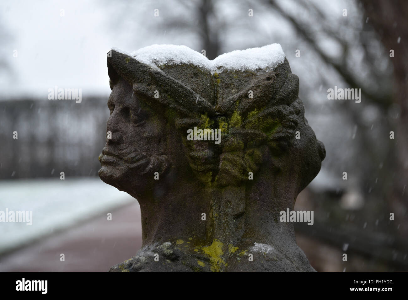Fulda, Germany. 23rd Feb, 2016. A double head stone figure is covered ...