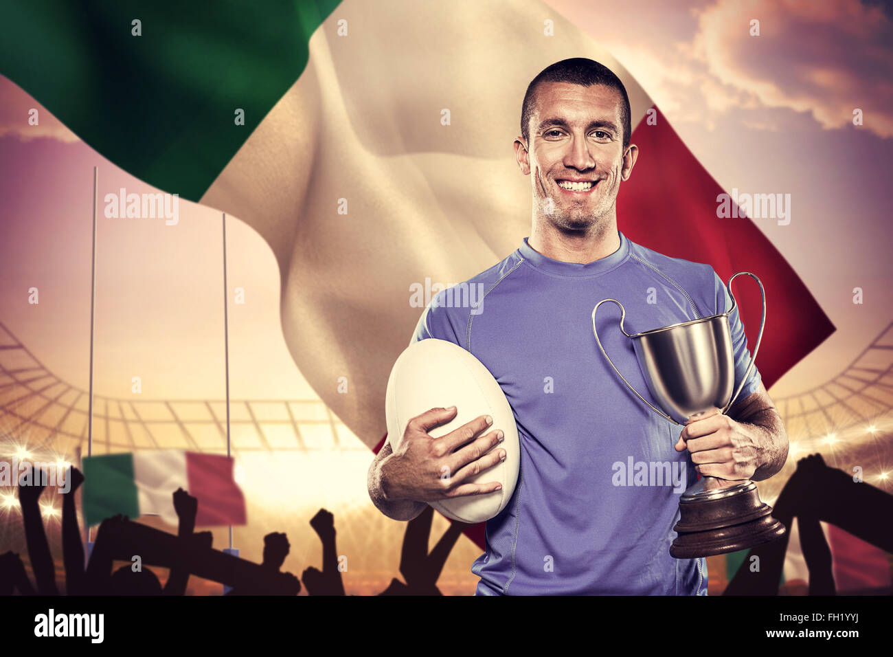 Composite image of portrait of smiling rugby player holding trophy and ...