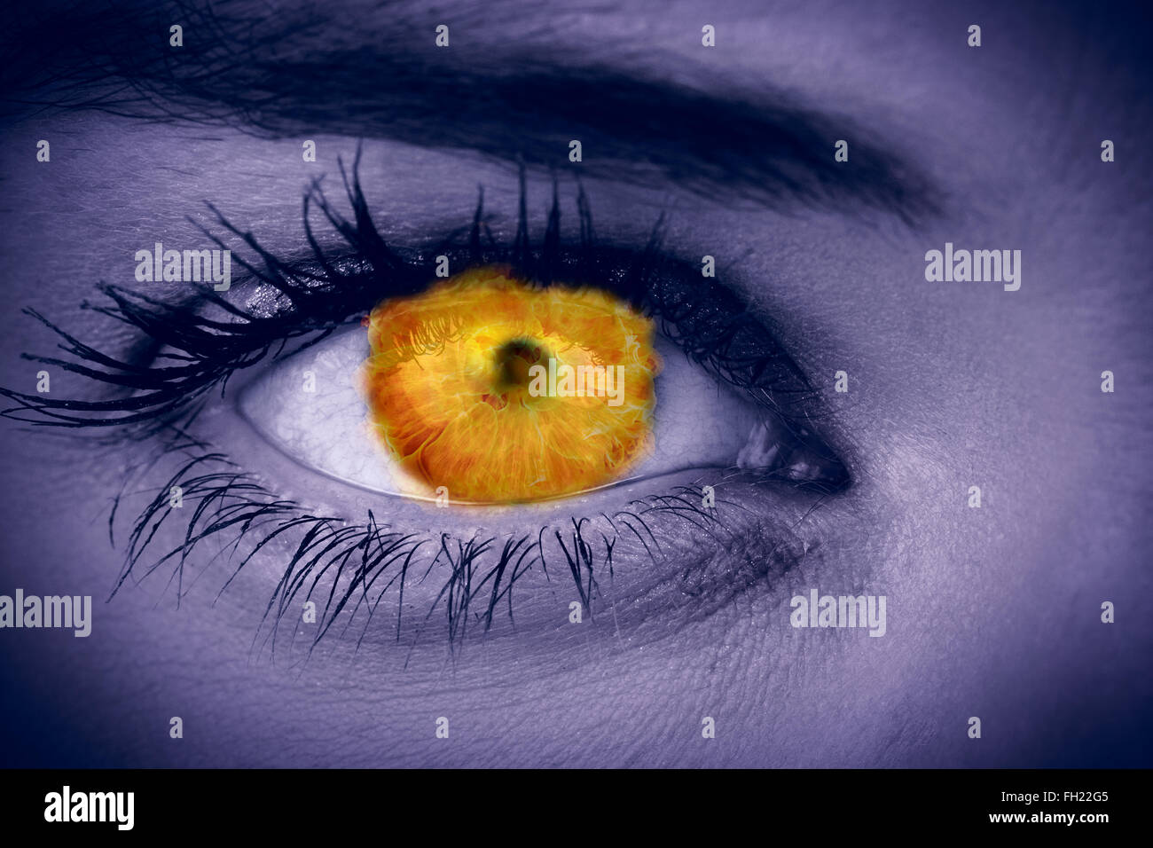 Composite image of orange eye on female face Stock Photo - Alamy