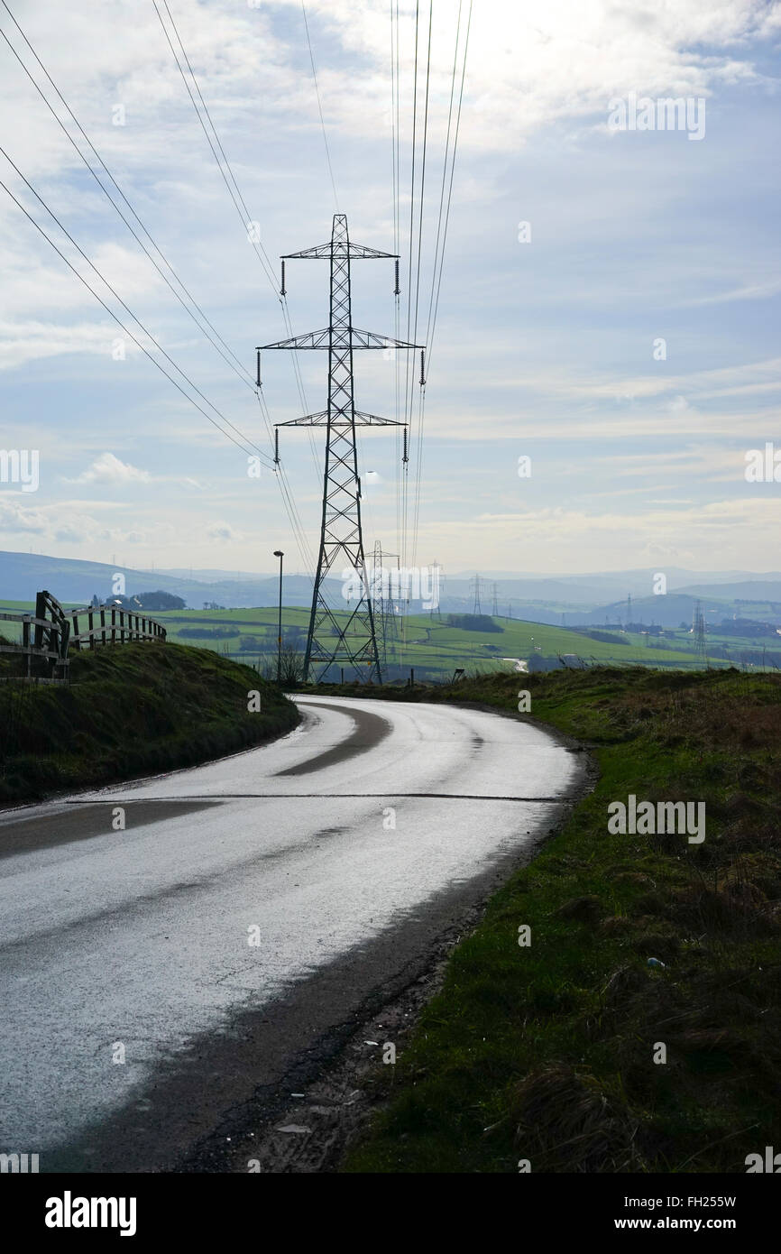 A line of Electricity pylons overlooking Tameside, Greater Manchester ...