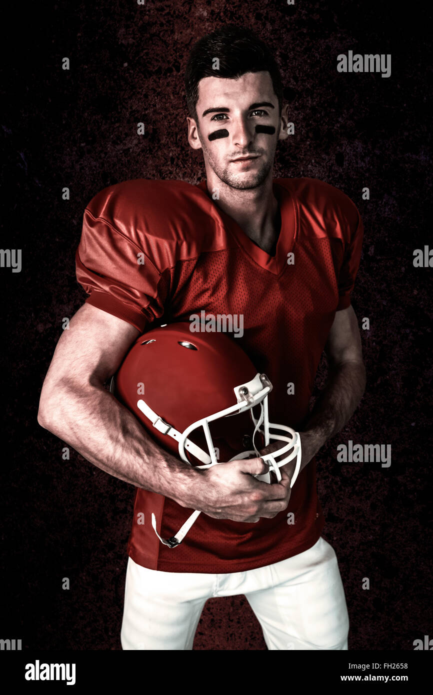Composite image of portrait of rugby player posing with helmet Stock ...