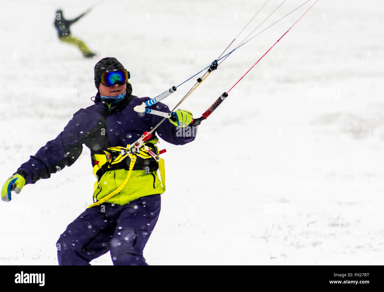 Man kite skiing on snow in wind Stock Photo - Alamy