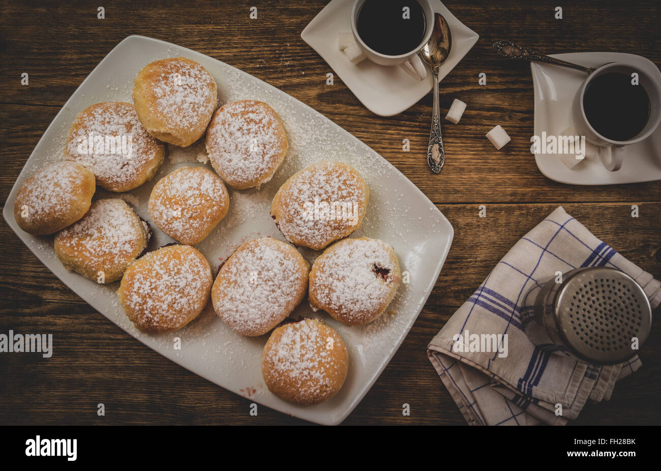 Traditional breaded cake with strawberry jam on wood table Stock Photo ...