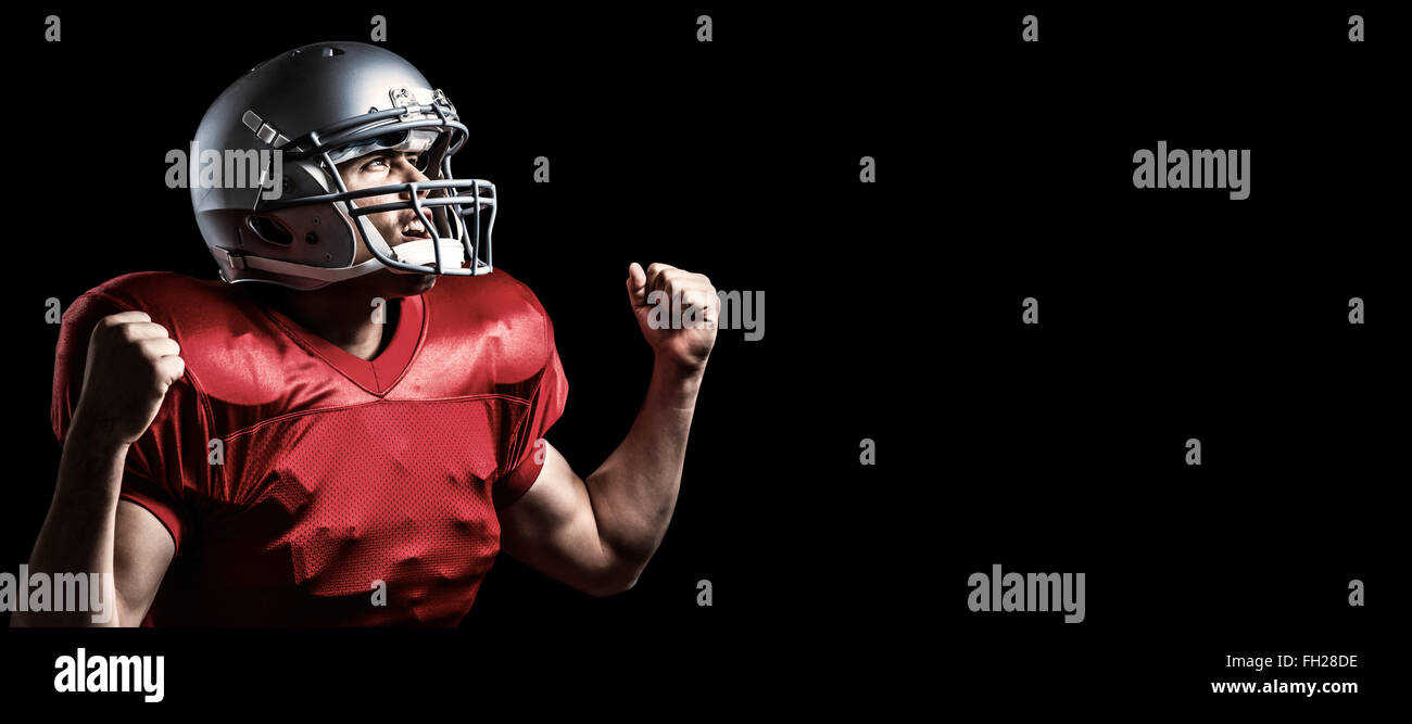 Composite image of american football player cheering with clenched fist ...