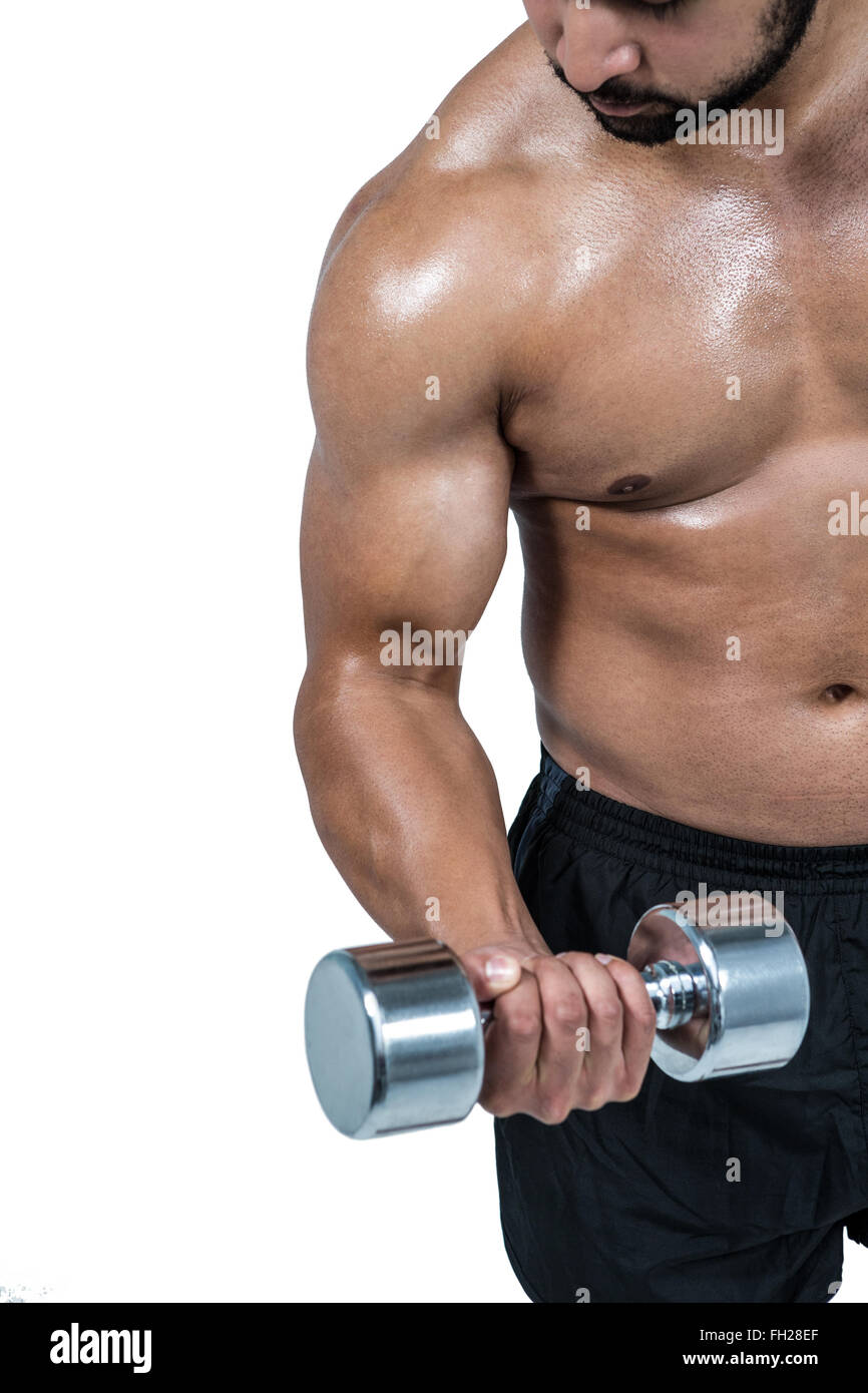 Muscular man lifting heavy dumbbell Stock Photo - Alamy
