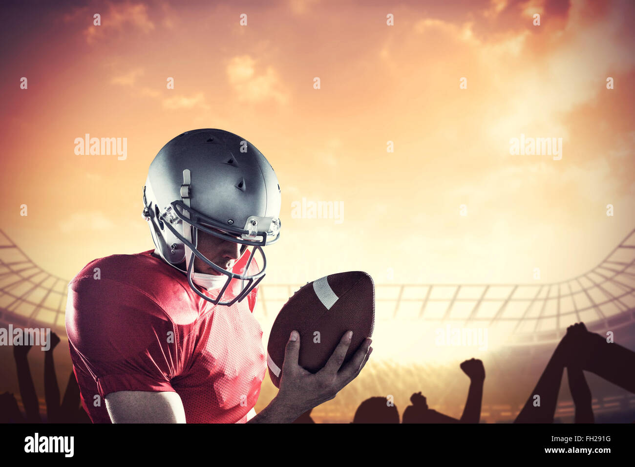 Composite image of sportsman looking at american football while ...