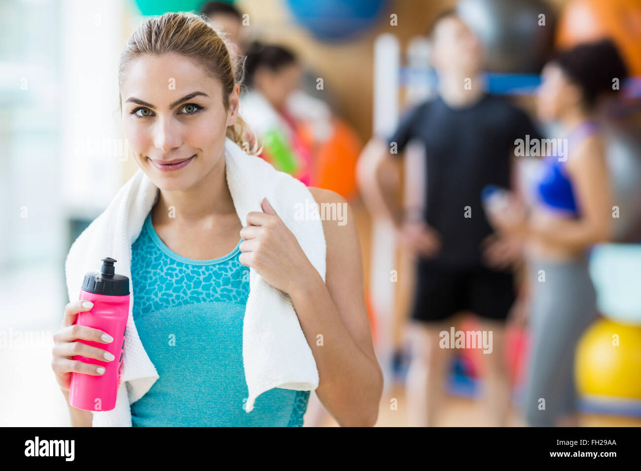 Fit woman smiling at camera Stock Photo - Alamy