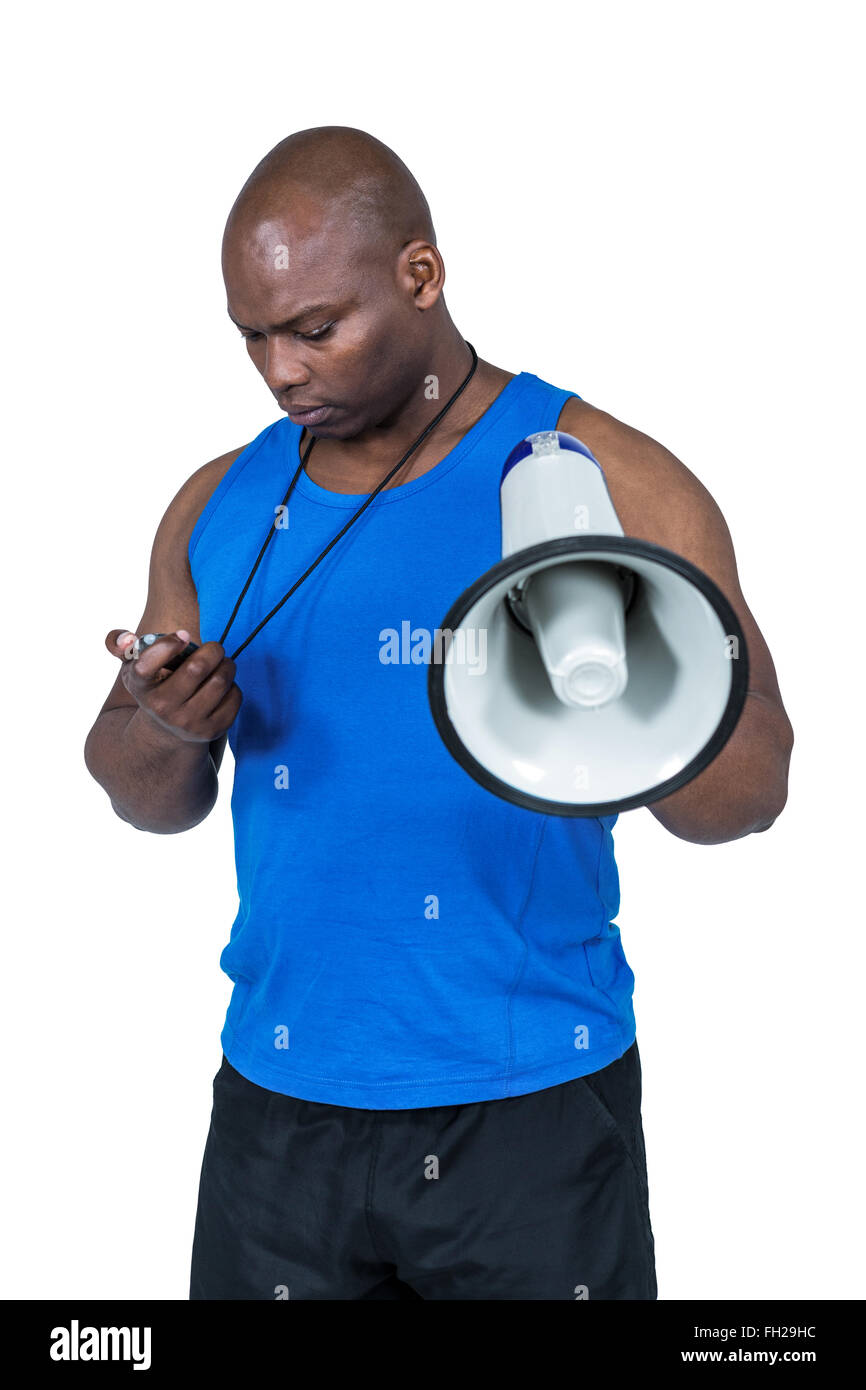 Fit trainer checking his stopwatch Stock Photo - Alamy