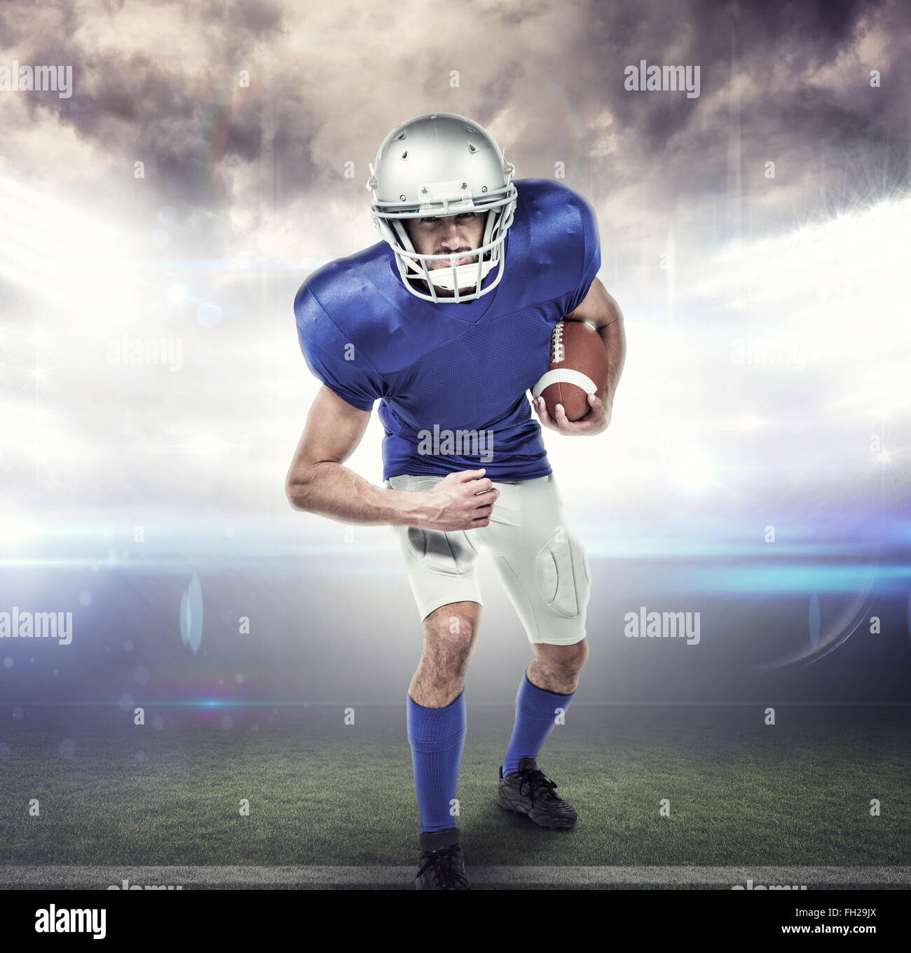Composite image of portrait american football player holding ball Stock ...