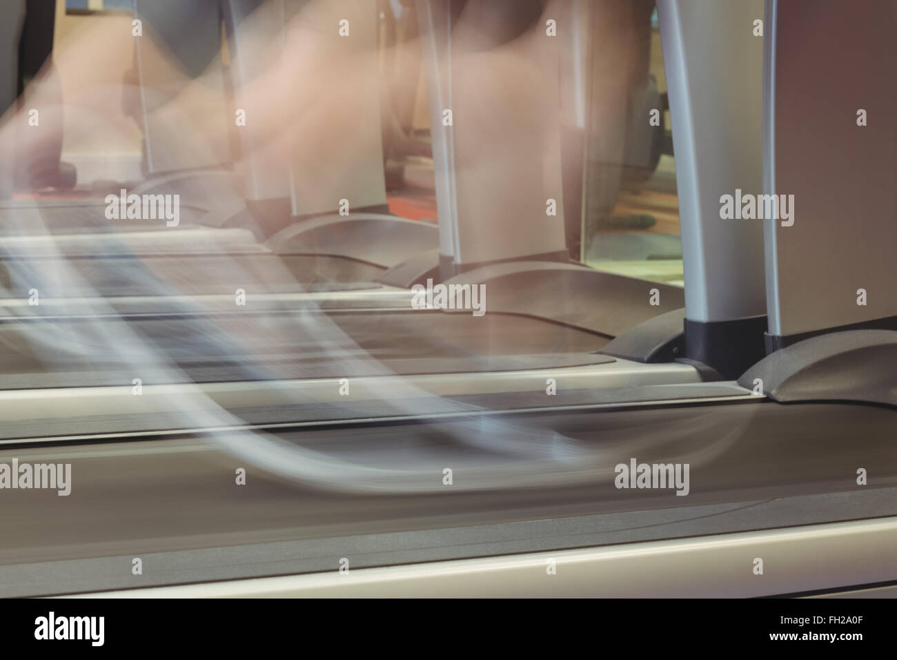 Fit people using the treadmill Stock Photo - Alamy