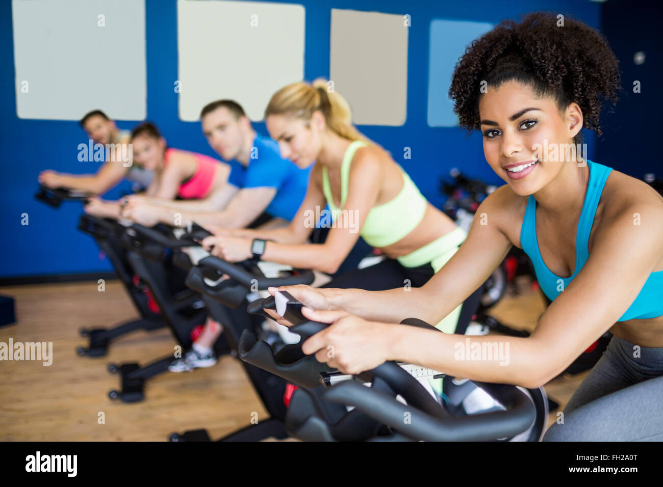 Fit people in a spin class Stock Photo - Alamy