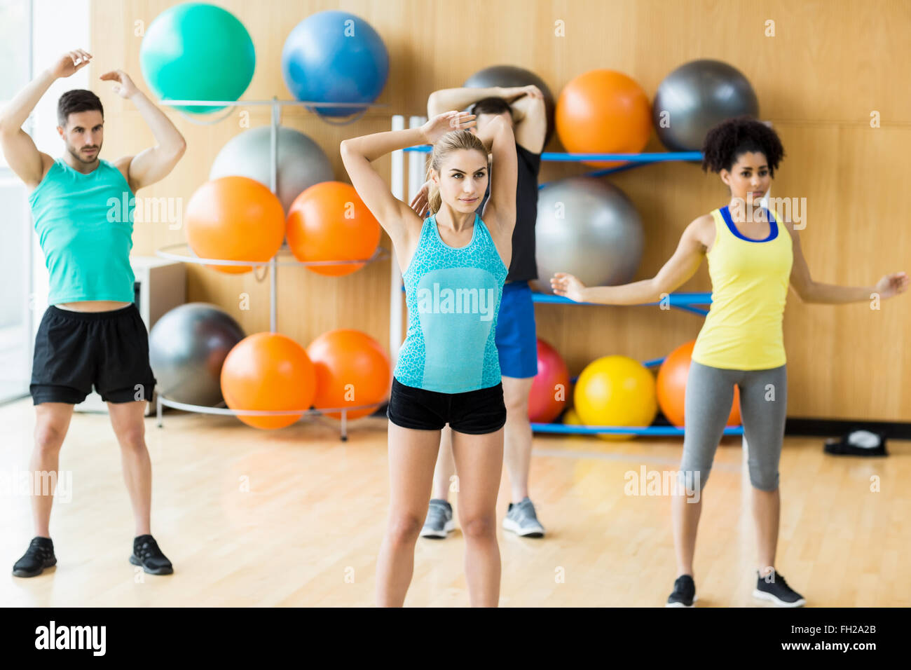 Fitness class exercising in the studio Stock Photo - Alamy