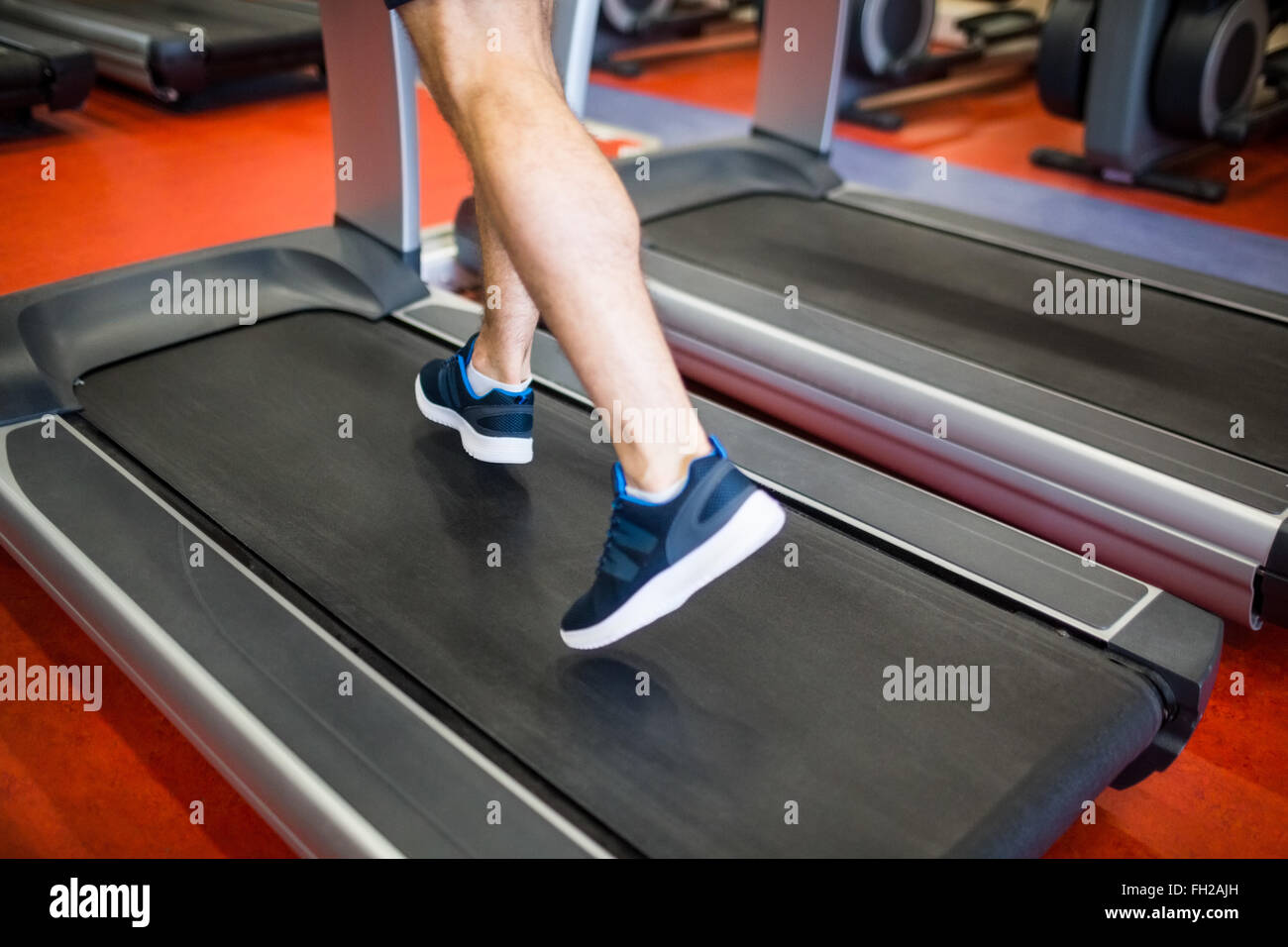 Man running on a treadmill Stock Photo - Alamy