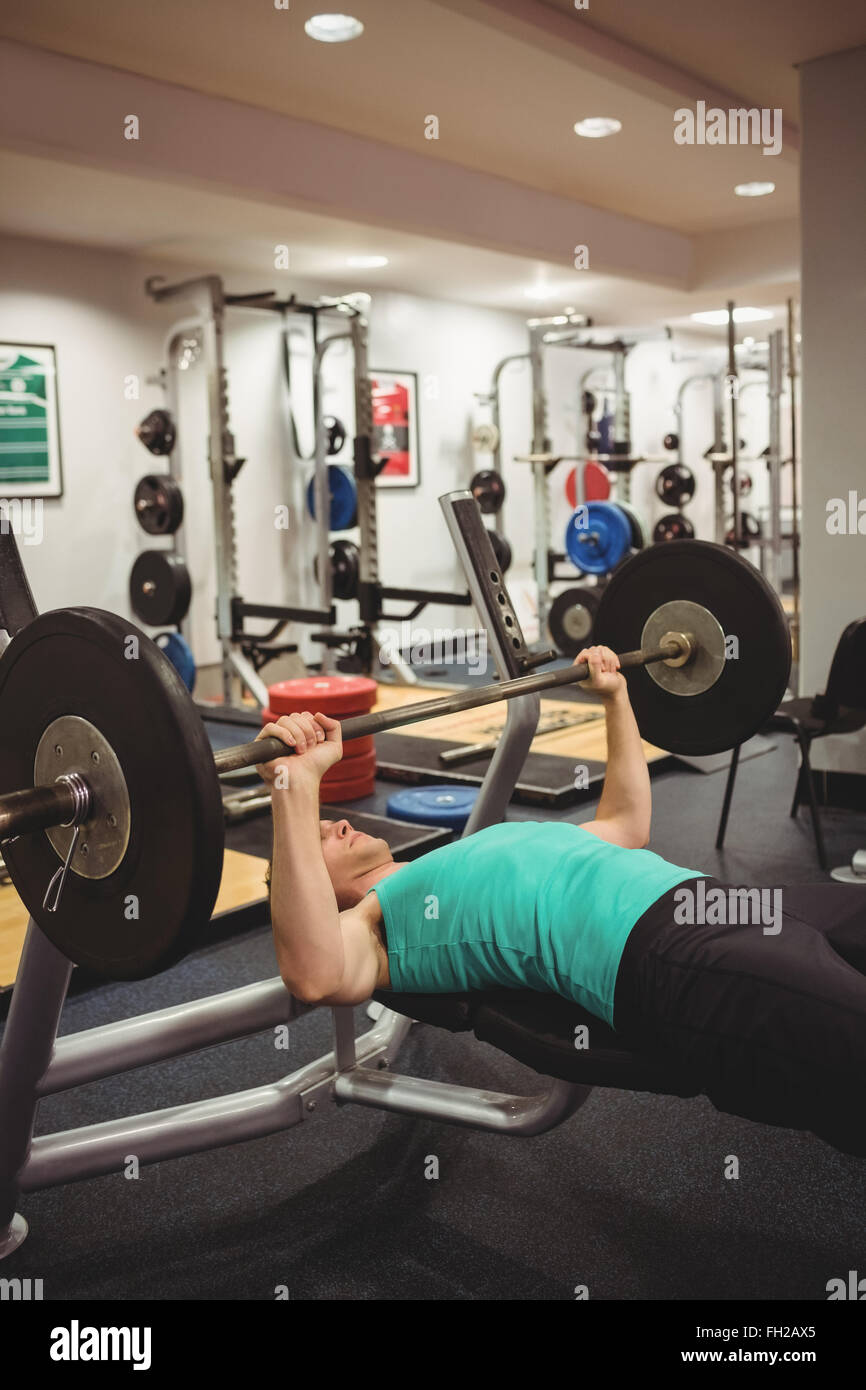 Fit man lifting heavy barbell Stock Photo - Alamy