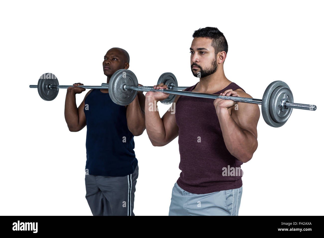 Man lifting barbell with trainer Stock Photo - Alamy