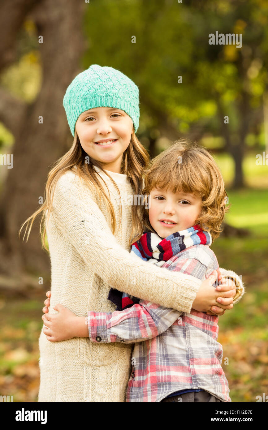 Happy siblings in the park Stock Photo - Alamy