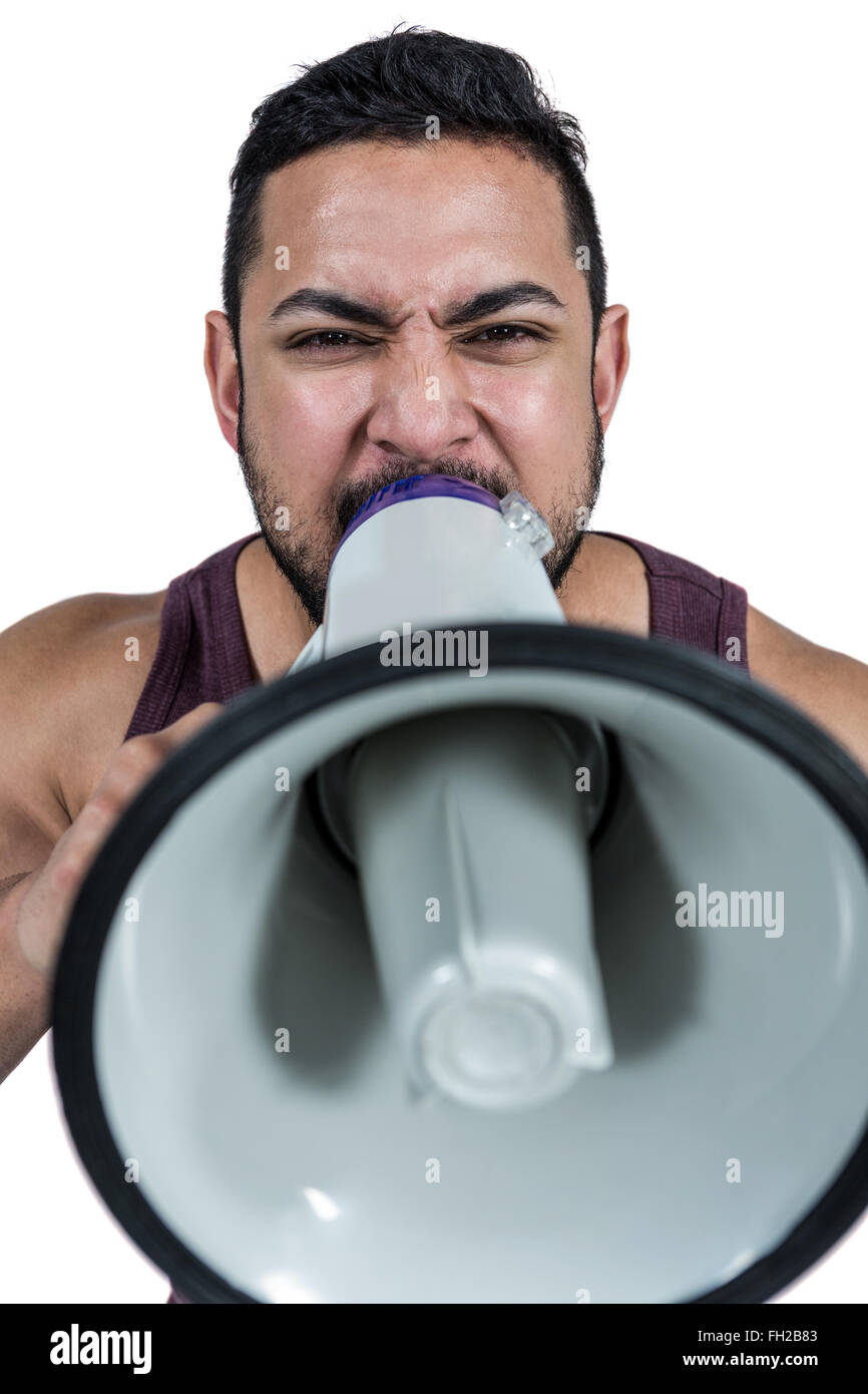 Muscular man yelling through a megaphone Stock Photo - Alamy