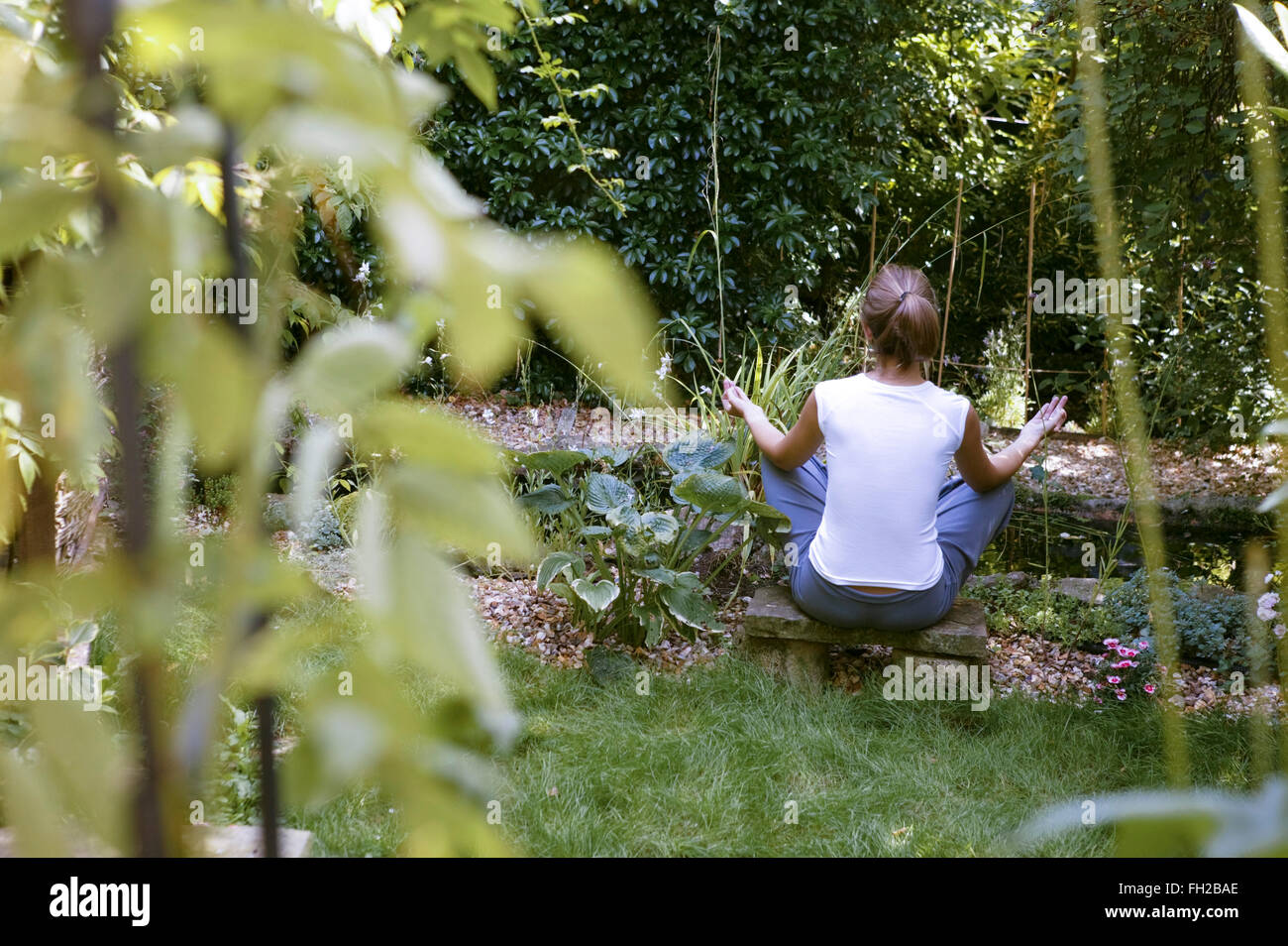 Woman meditating sitting calm uk hi-res stock photography and images ...
