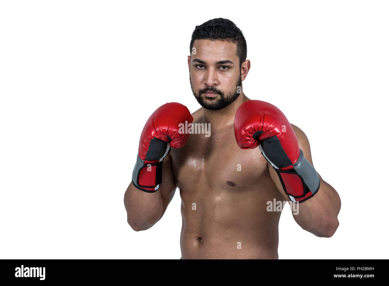 Muscular man boxing in gloves Stock Photo - Alamy
