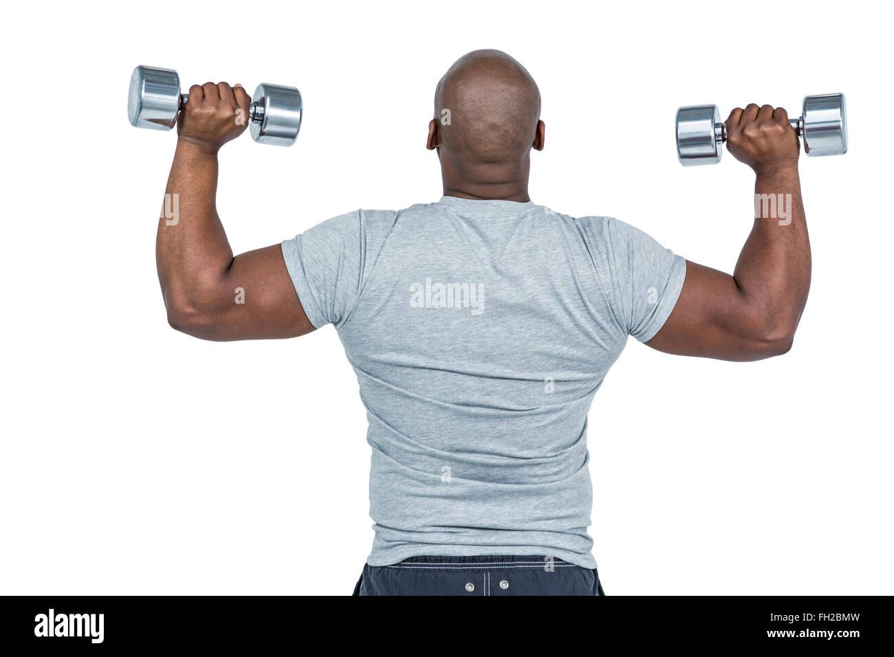 Fit man exercising with dumbbells Stock Photo - Alamy