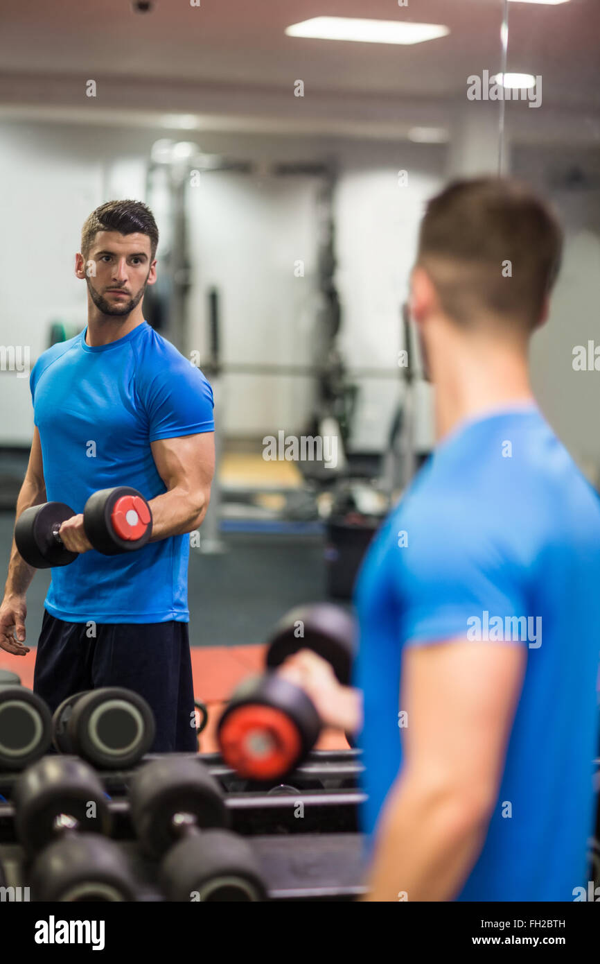 Man using weights in his workout Stock Photo - Alamy