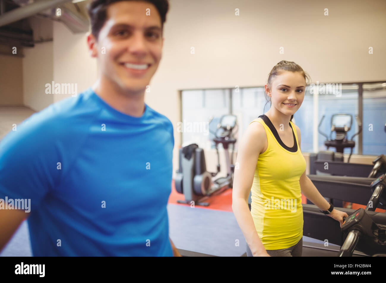 Fit people using the treadmill Stock Photo - Alamy